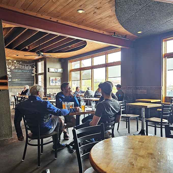 Locals and visitors alike gather in this comfortable space where conversation flows as freely as the craft beer.