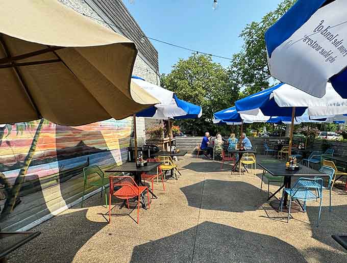 The outdoor patio beckons with colorful umbrellas and fresh air, perfect for enjoying your Huevos Rancheros while soaking up some Minneapolis sunshine happily.