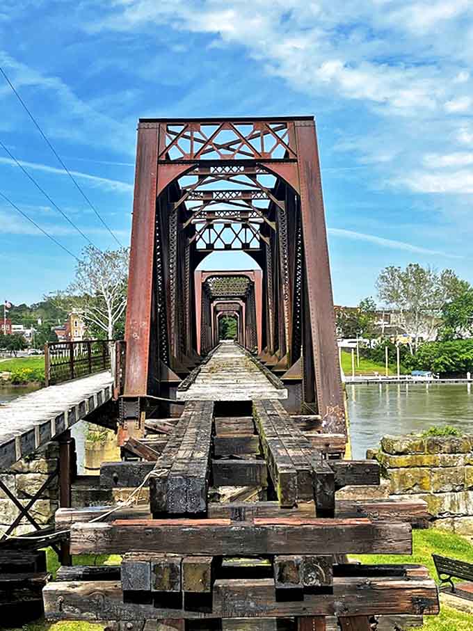 Perspective perfection: The historic bridge creates a mesmerizing tunnel of iron and steel stretching across the peaceful Muskingum River.