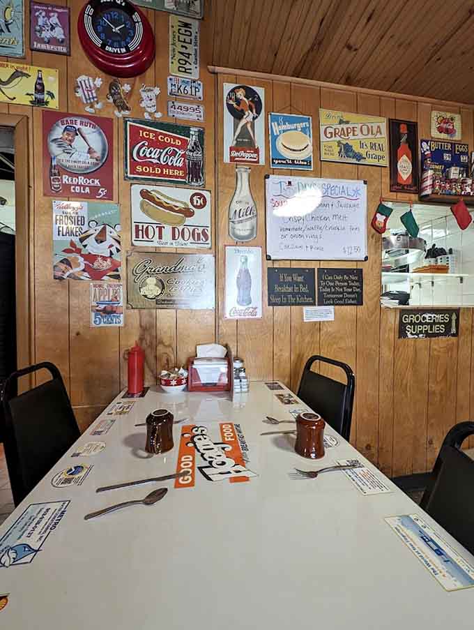 Vintage advertising signs cover the walls like a museum dedicated to brands your grandparents remember buying.