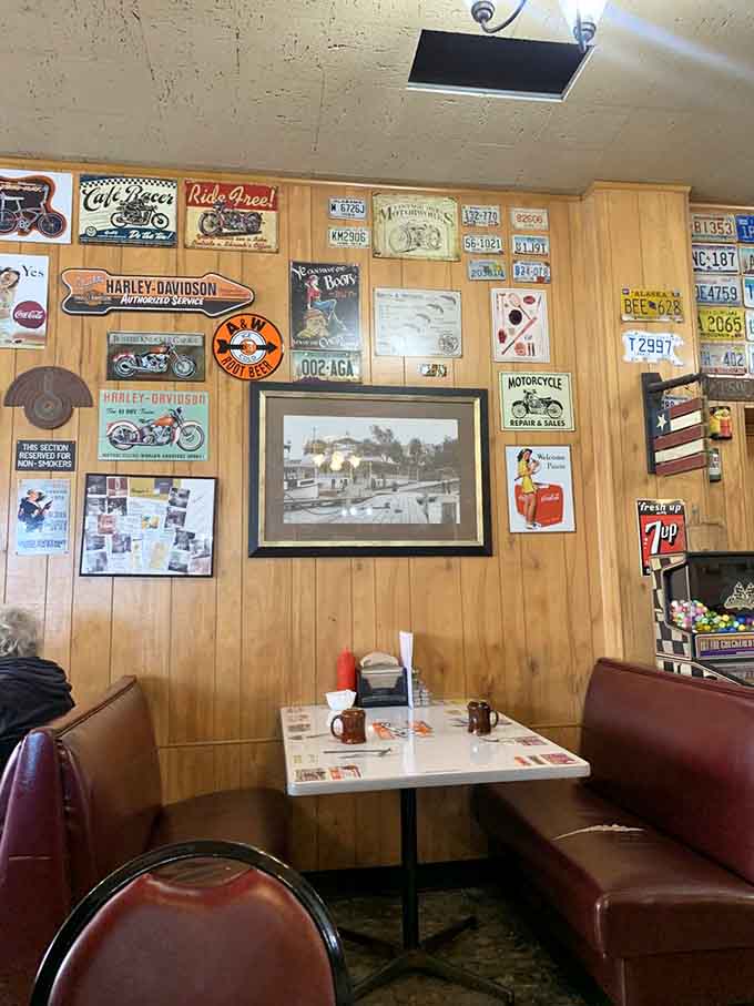 Vintage signs, Harley-Davidson memorabilia, and old license plates turn every wall into a conversation starter while you wait for your food.