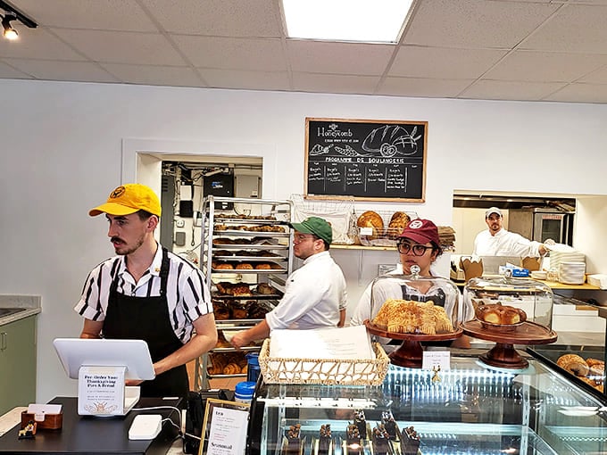 Behind the counter is where the magic happens. These bakers aren't just employees&mdash;they're guardians of ancient grain wisdom in modern Florida.
