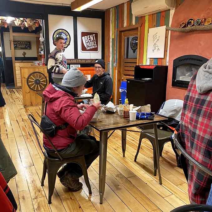 Happy diners enjoying their meals in a space that feels like the cool friend's house where everyone's always welcome and fed well.