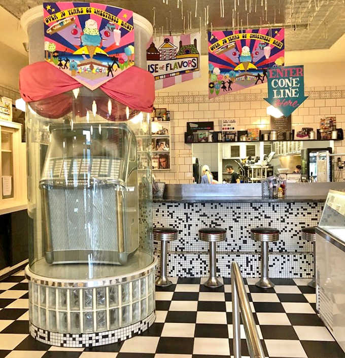 Black and white tiles, chrome accents, and that jukebox vibe – this counter area is where ice cream dreams come true.