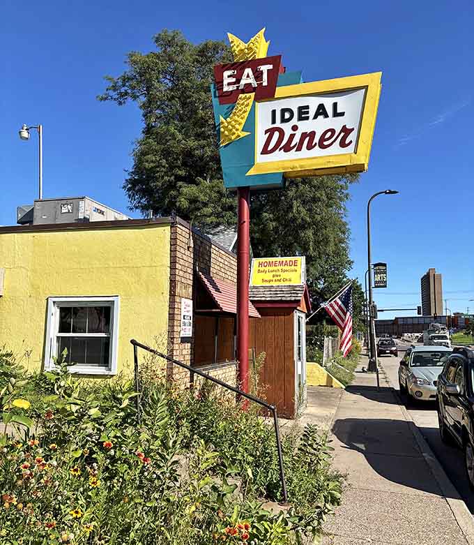 That classic sign against a blue sky promises exactly what it delivers: a place to eat well, feel welcome, and remember why diners matter.