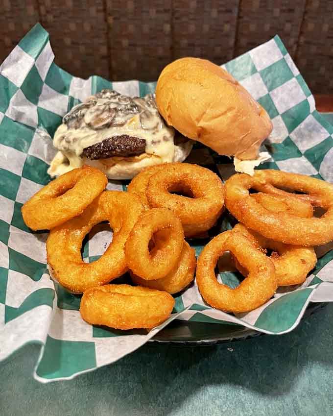 That mushroom burger with onion rings represents comfort food elevated to an art form worth celebrating.