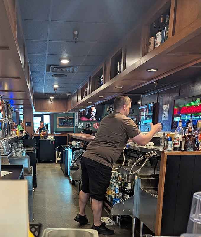 Friendly staff work efficiently behind the bar, mixing drinks and serving customers with the kind of genuine hospitality that can't be faked.