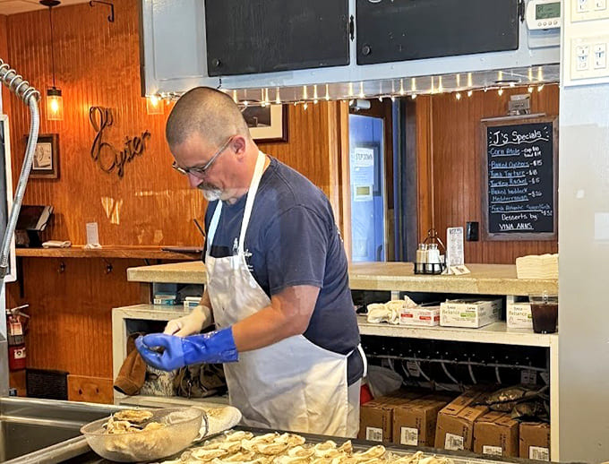 Staff working with the kind of practiced efficiency that only comes from doing something well for a very long time.