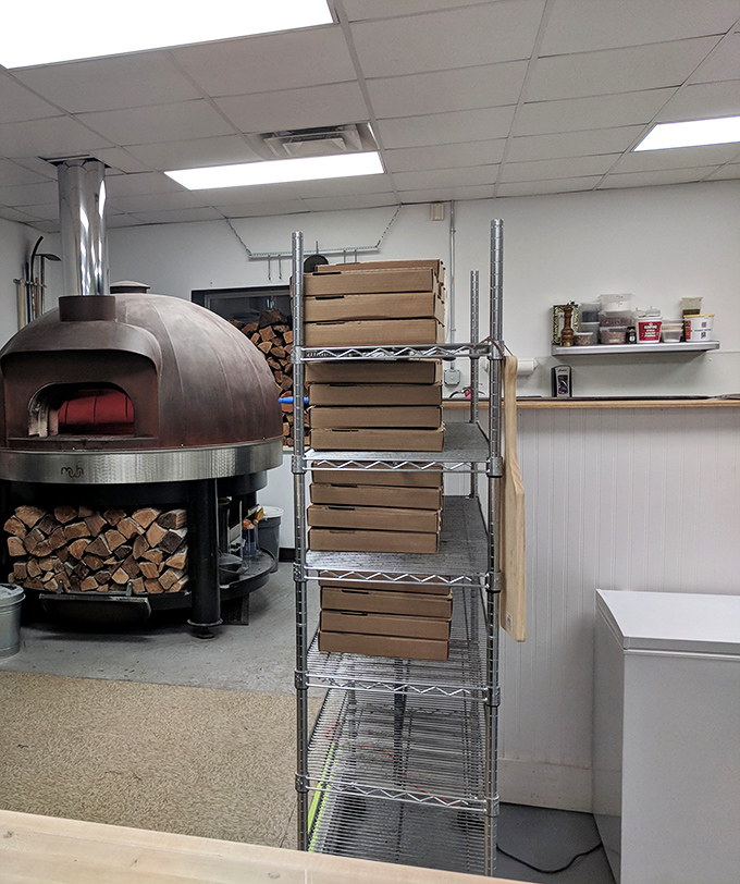 The wood-fired oven dominates the kitchen space, a testament to Rover's commitment to traditional methods that yield exceptional results.