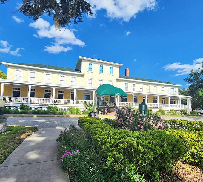 The historic Lakeside Inn stands majestically in yellow splendor, its wraparound porch practically demanding you sit a spell with sweet tea.