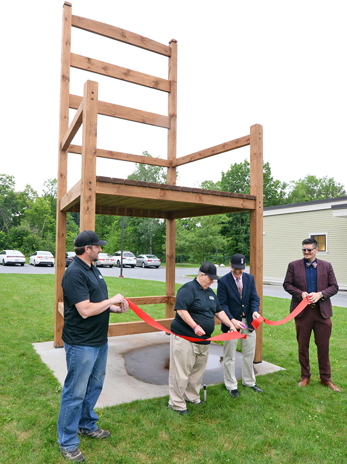 A ribbon-cutting ceremony celebrates the chair's installation or restoration. When your furniture warrants an official ceremony, you know you've transcended ordinary household items.