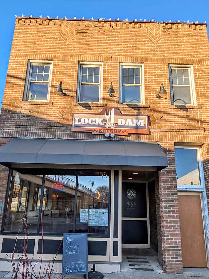 The classic brick building stands proud against a blue sky, its vintage charm perfectly complementing the modern culinary magic happening inside.