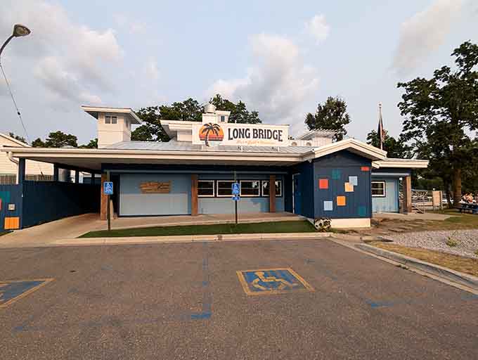 The parking lot view hints at the waterfront magic waiting just steps away from your car door.
