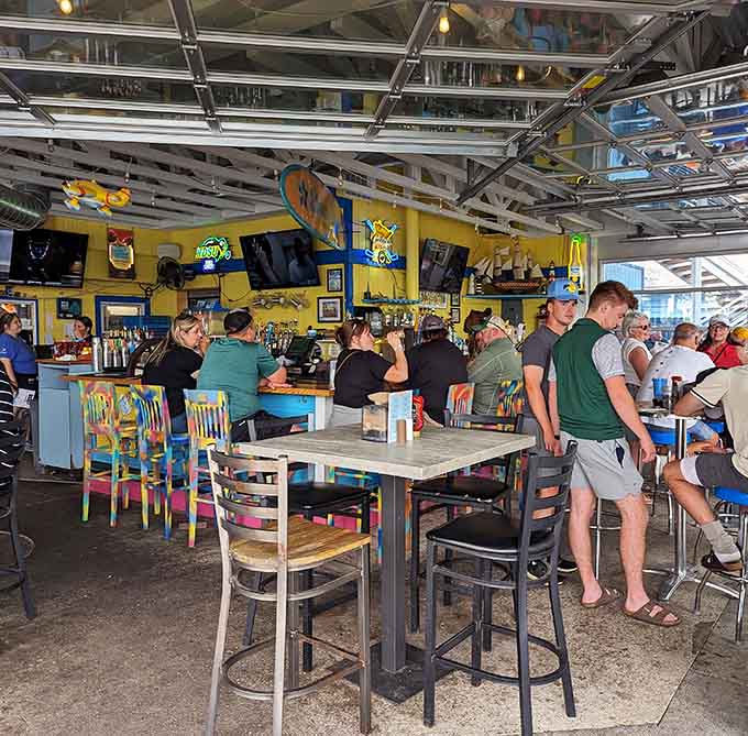 The bar area combines functionality with style, offering plenty of seating options whether you're there for drinks or dinner.