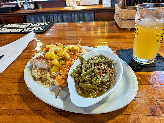 A vacation-worthy mahi-mahi plate with vibrant veggies and southern-style green beans worth savoring slowly.