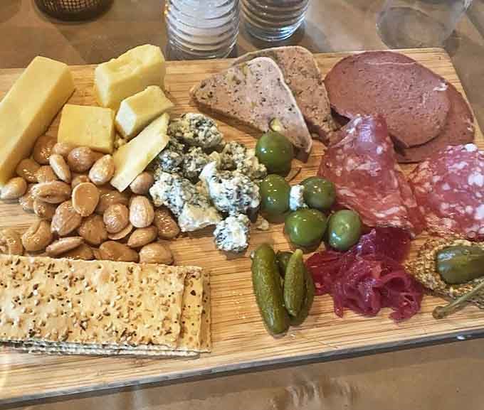 This cheese and charcuterie board creates a landscape of flavors &ndash; from creamy blues to aged cheddars, paired with cured meats and house-made pickles.