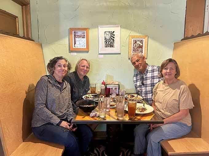 Happy diners enjoying their meals in a space that feels like your coolest friend's kitchen, if your friend happened to be an interior designer.