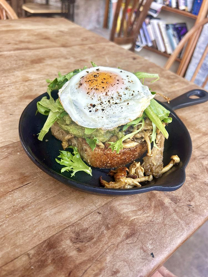 Mushroom toast celebrates fungi in all their earthy glory, perched atop house-made bread with a perfectly cooked egg crown.