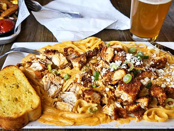 Nashville meets Italy in this spicy chicken pasta &ndash; creamy fettuccine topped with crispy seasoned chicken, green onions and a sprinkle of cheese.
