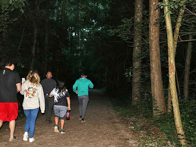 As darkness falls, brave explorers venture toward the tunnel, unaware of what might be watching from the shadows.