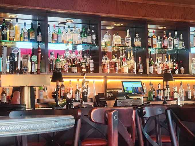 The bar area gleams with promise, bottles lined up like soldiers ready to create your perfect drink pairing.