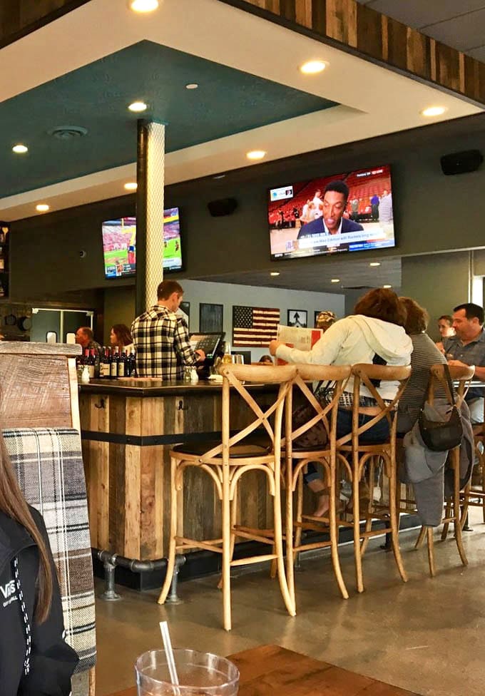 Bar seating offers front-row views of the action, where skilled bartenders craft drinks that perfectly complement your meal choices.