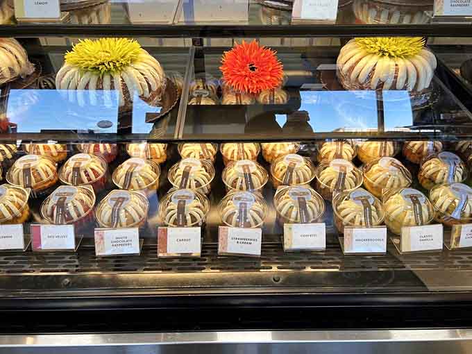 The display case showcases rows of perfectly frosted bundts, each one practically begging to come home with you.