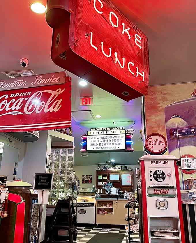 Neon signs and vintage gas pumps create an atmosphere that's part museum, part restaurant, entirely delightful throughout.