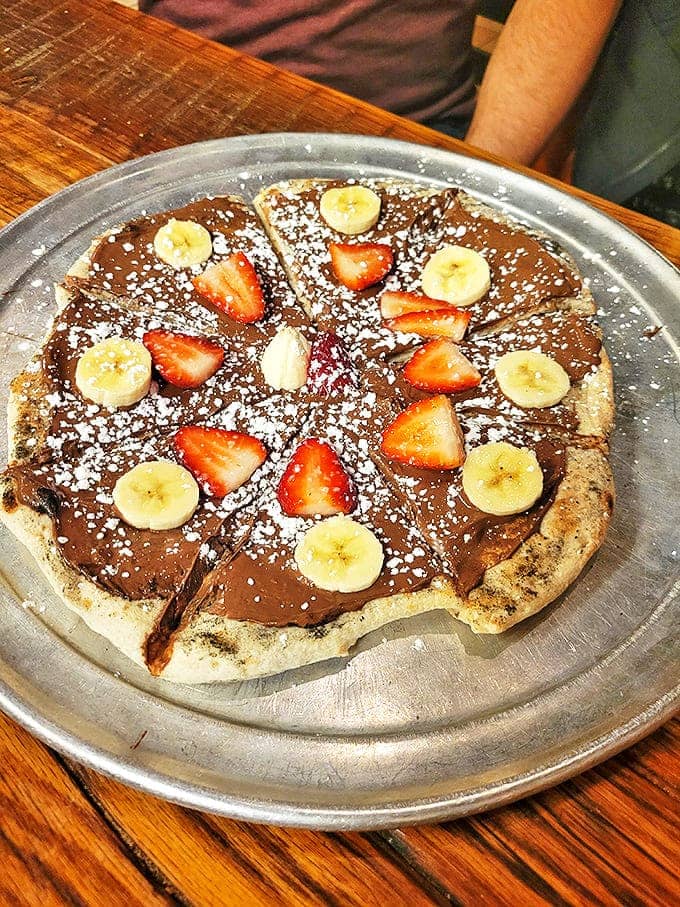 Nutella Pizza: Dessert reimagined &ndash; a sweet pizza canvas painted with Nutella and dotted with fresh fruit. It's what would happen if breakfast and dessert had a delicious baby.