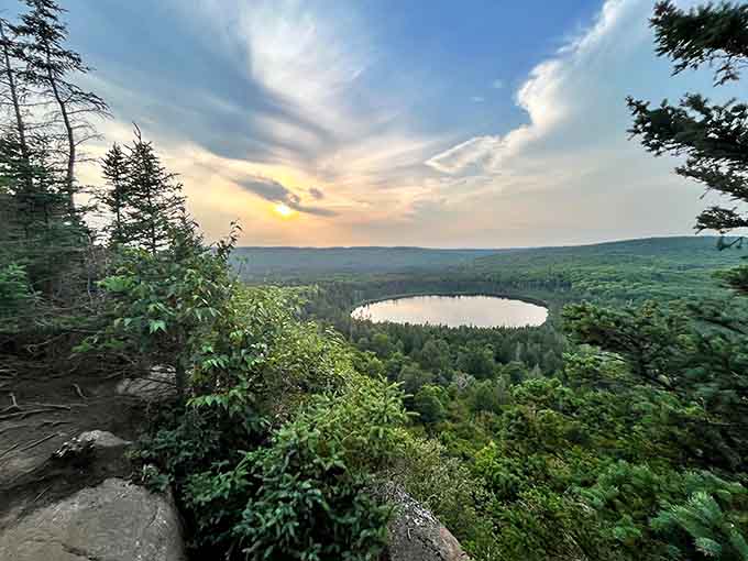 That perfect oval of blue surrounded by endless green is what happens when nature decides to create something frame-worthy without even trying.