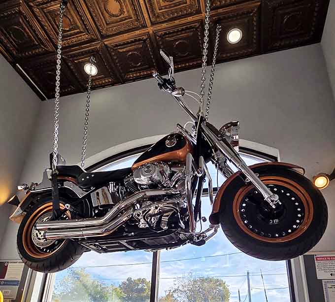 A motorcycle suspended from the ceiling adds unexpected whimsy to the decor, proving diners can have personality and great food simultaneously.
