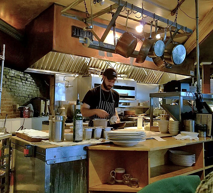 In the open kitchen, focused chefs work their magic without drama &ndash; just the quiet confidence of people who know exactly what they're doing.