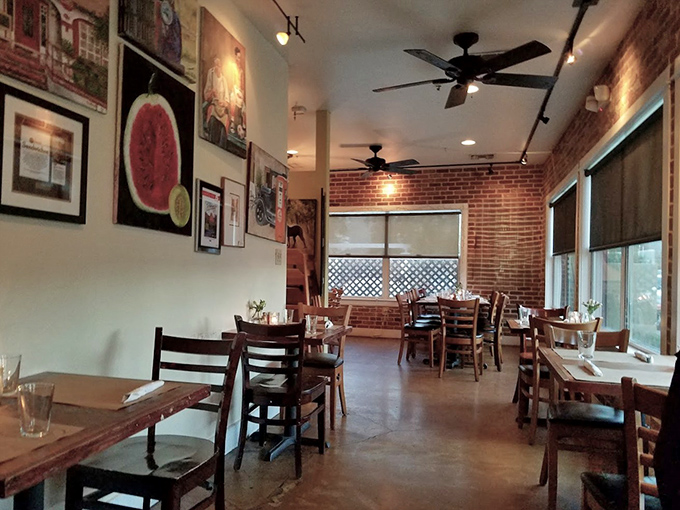 Other Interior Angle: Rustic charm meets urban cool in this dining room where exposed brick walls and thoughtful artwork create an atmosphere of casual sophistication.