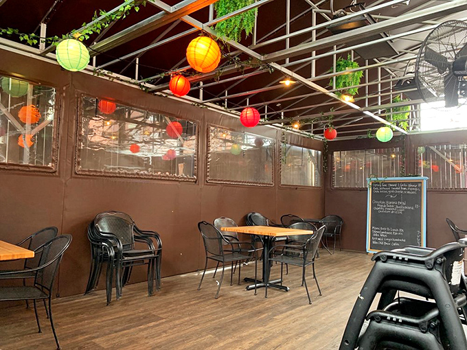 Colorful paper lanterns create a festive atmosphere on the outdoor patio, perfect for enjoying exceptional food while watching Portland life unfold.