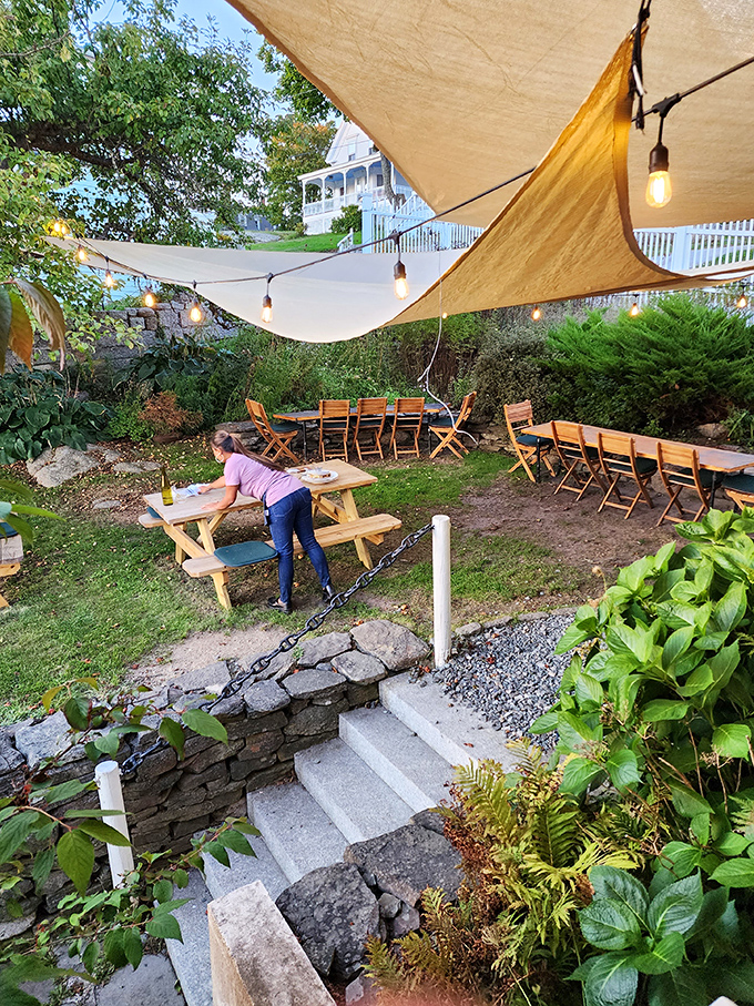The garden patio, with its string lights and casual picnic tables, becomes the most coveted dining spot during Maine's perfect summer evenings.