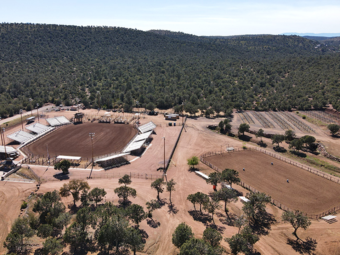 Explorers gain perspective beneath the massive arch, their presence highlighting the humbling scale of nature's architectural achievement.