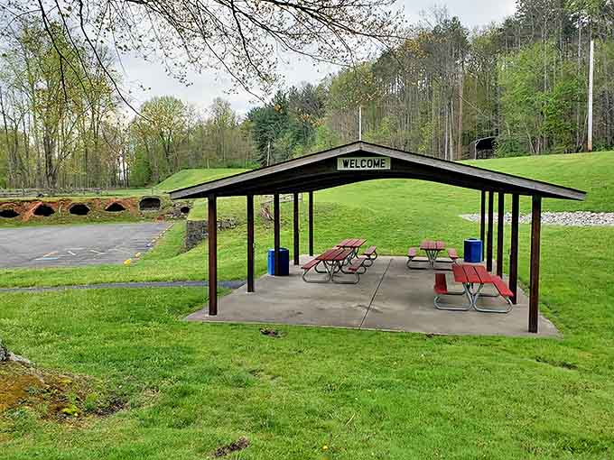 A simple shelter provides respite for modern explorers, standing where workers once sought brief shadows from the ovens' relentless heat.