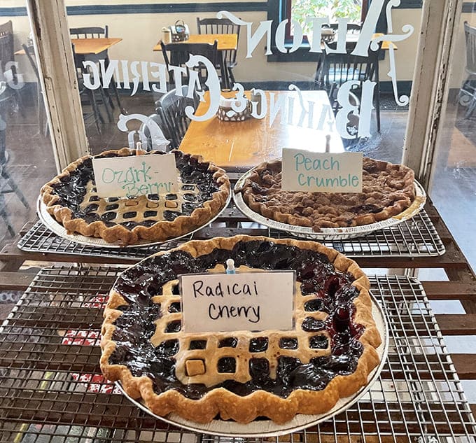 Fresh pies cooling on racks like edible trophies, each one a testament to someone's dedication to making your day better.