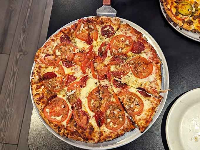 Pepperoni circles dot the landscape like delicious polka dots, each one promising a little burst of spicy, savory satisfaction ahead.