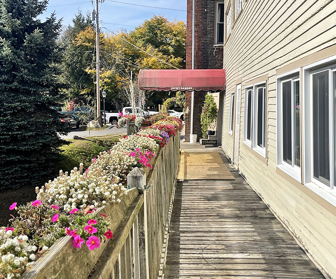 Flower-lined walkways welcome visitors to Lucky Garden, where nature's beauty complements the culinary treasures inside.