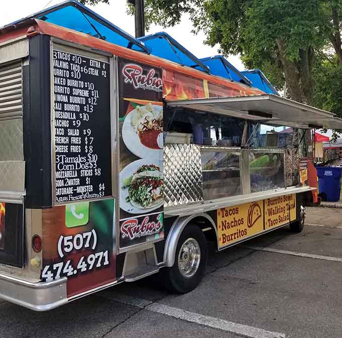 That food truck at dusk, all lit up and ready to serve, looks like a beacon of hope for hungry souls wandering the streets.