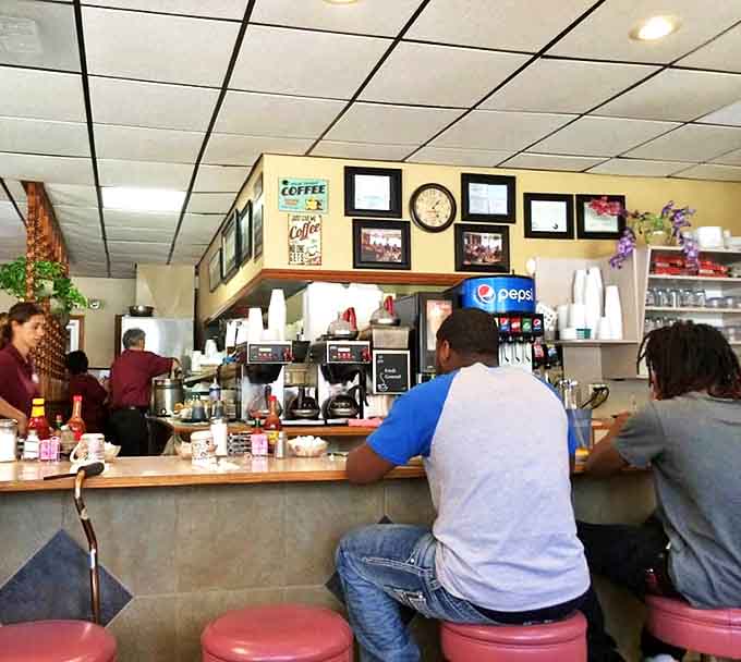 Pink counter stools invite patrons to spin slightly while waiting for their order &ndash; a small joy that never gets old.