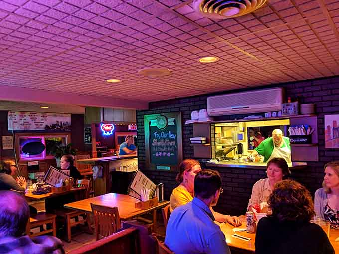 Happy diners fill the cozy space, proving that word-of-mouth reputation brings people together over seriously good comfort food.