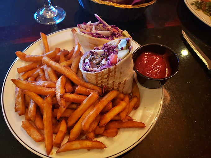 Portable Mediterranean magic! This shawarma wrap and crispy fries combo is the perfect on-the-go meal for busy flavor seekers.