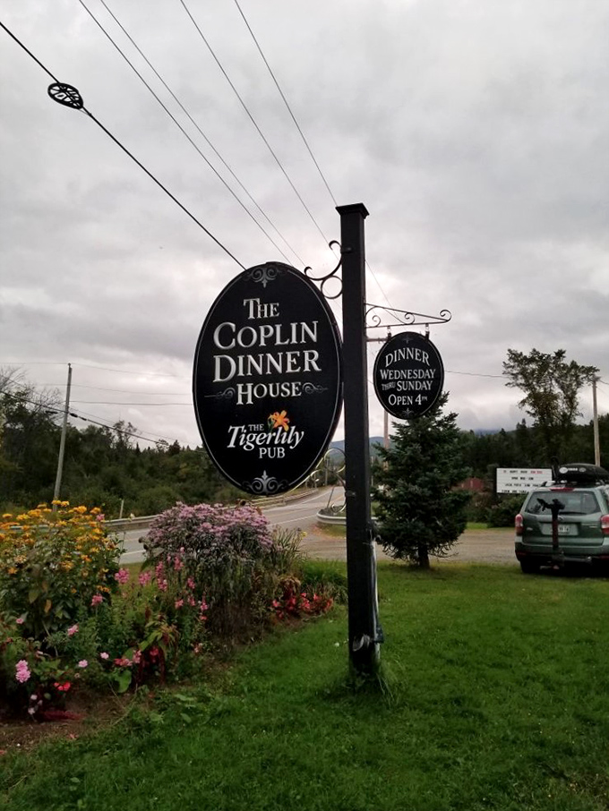 The restaurant's sign stands as a beacon for hungry travelers, promising culinary delights just beyond those doors.