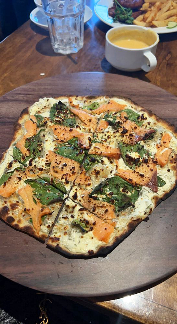 This flammkuchen with smoked salmon isn't just a flatbread &ndash; it's a crispy canvas showcasing the delicate balance of creamy cheese and smoky fish.
