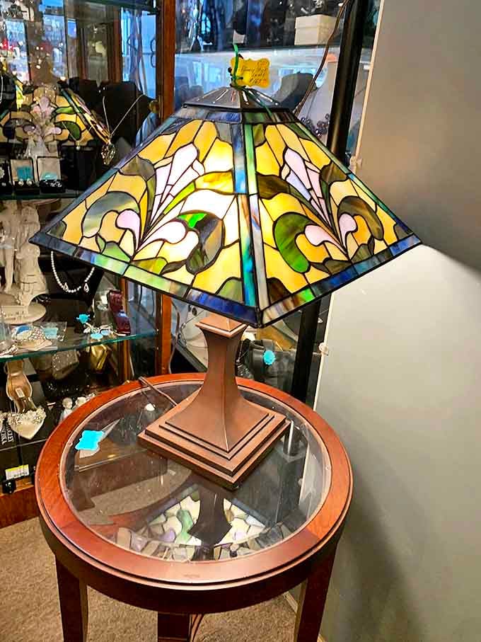13. stained glass table lampA stained glass lamp that casts light like a kaleidoscope, making your living room feel like a cathedral designed by someone with excellent taste.