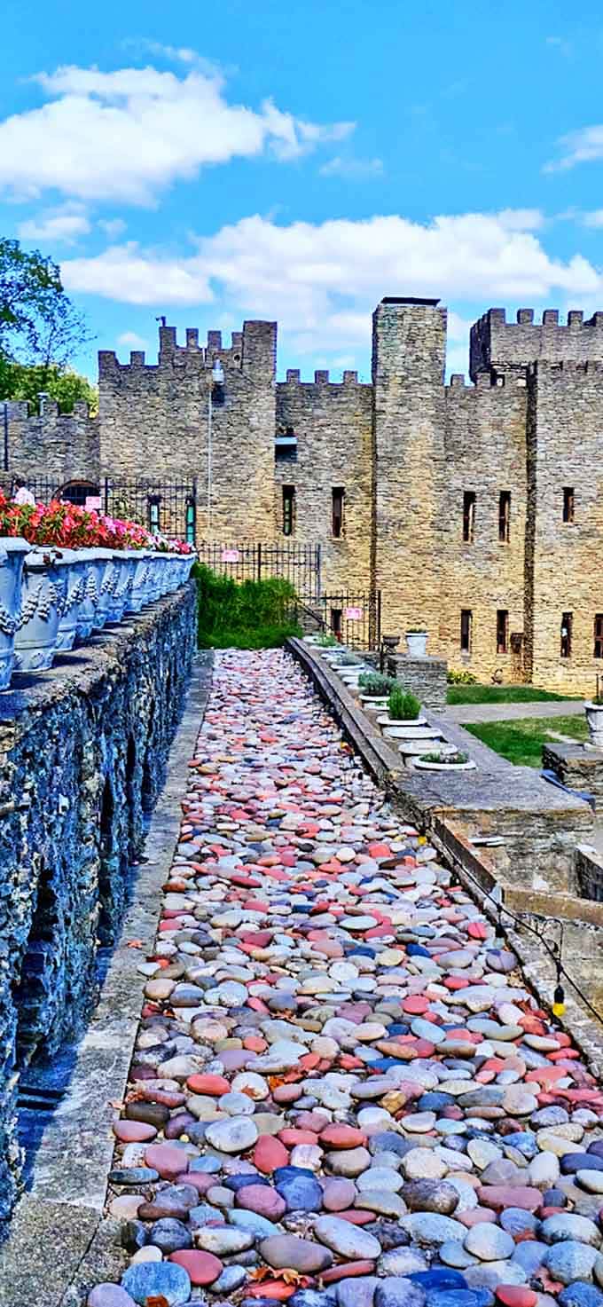 A rainbow of river stones creates a path fit for royalty &ndash; much easier on royal feet than the authentic mud paths of medieval times.