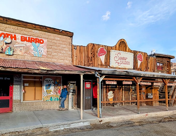 The Sugar Saloon's weathered facade promises sweet relief from the desert heat &ndash; if you can get past the burro blockade.