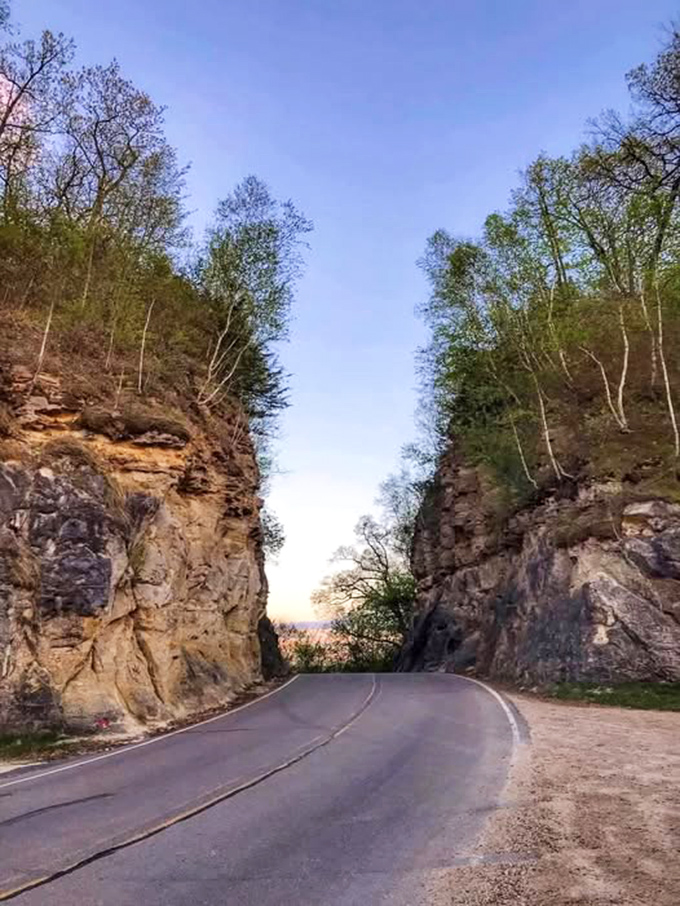 Golden hour magic: Sunset casts a warm glow through the cut, highlighting the texture of rocks shaped by human hands.